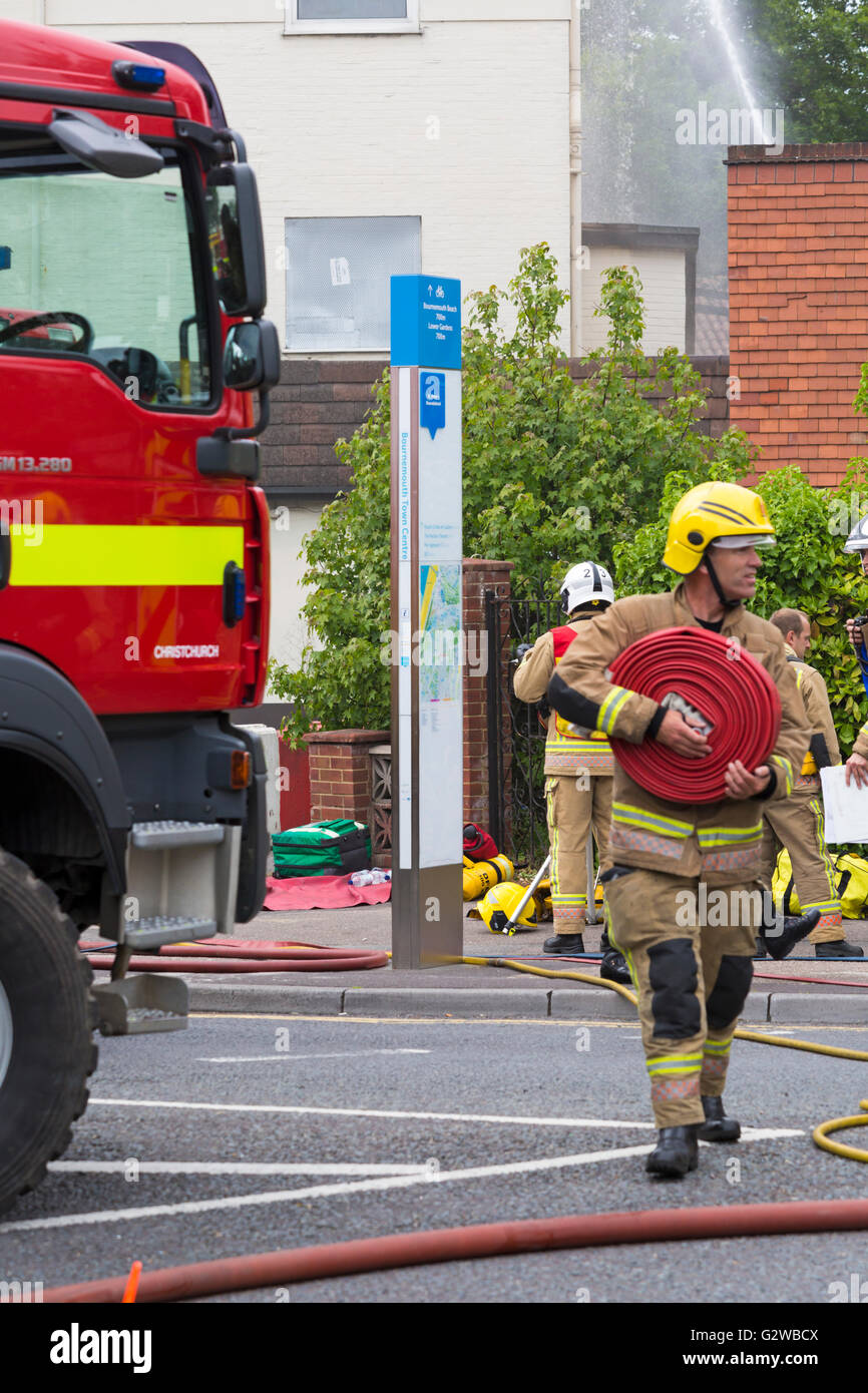 Bournemouth, Dorset UK 3 June 2016. Fire crews putting out fire at old ...