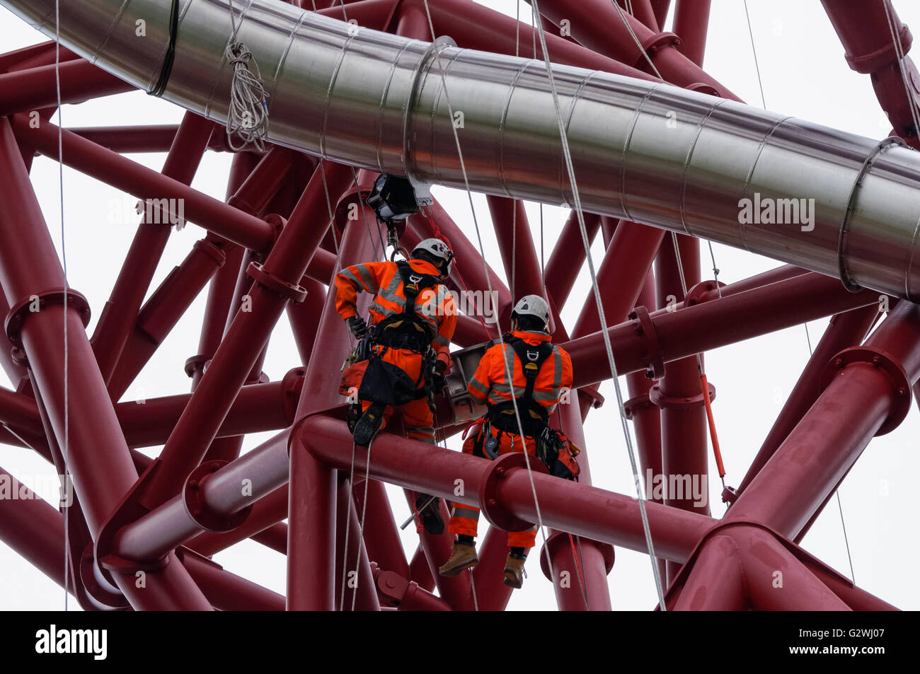 Workers at the ArcelorMittal Orbit slide at the Queen Elizabeth Olympic ...