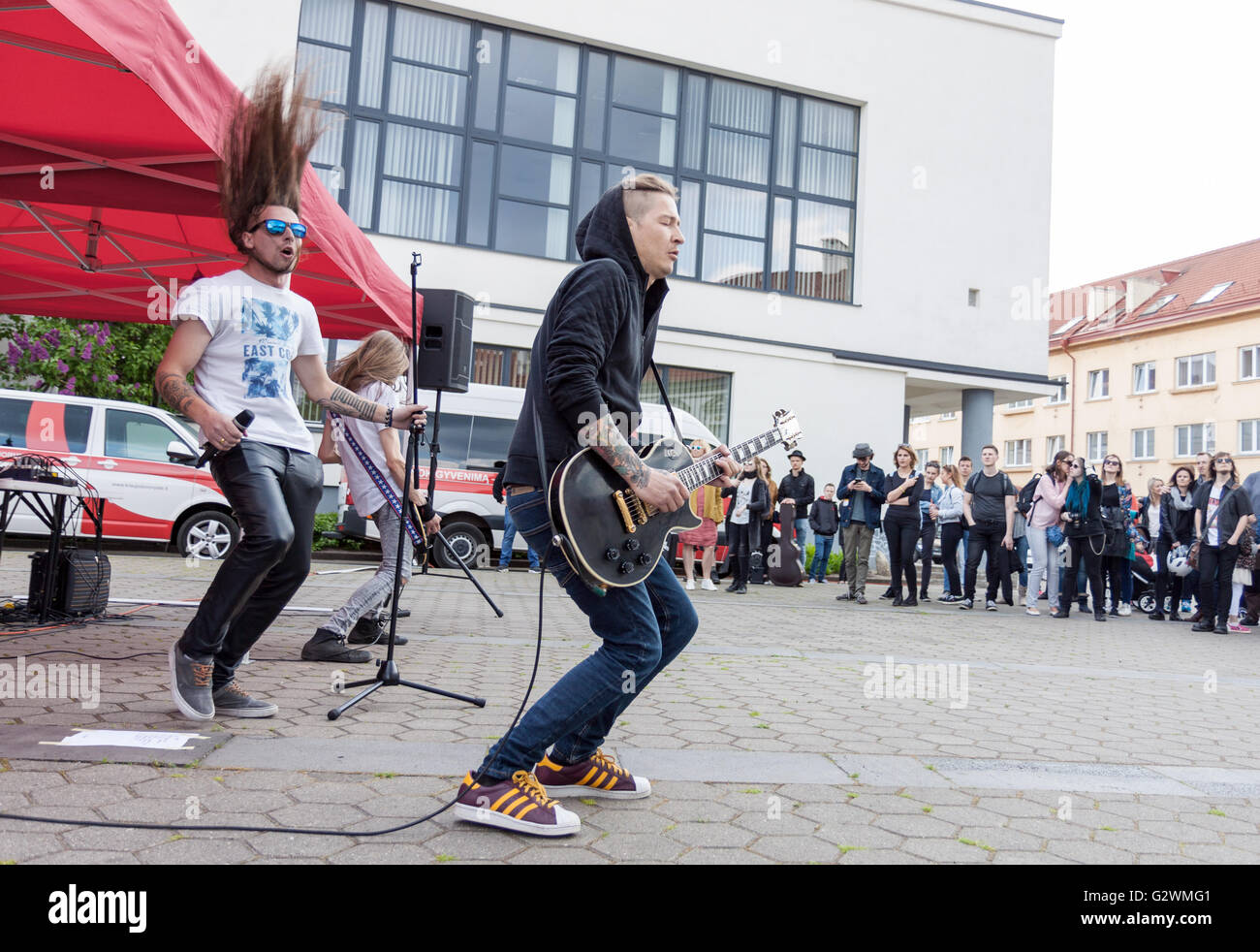 Men rock band performing on the street Stock Photo - Alamy