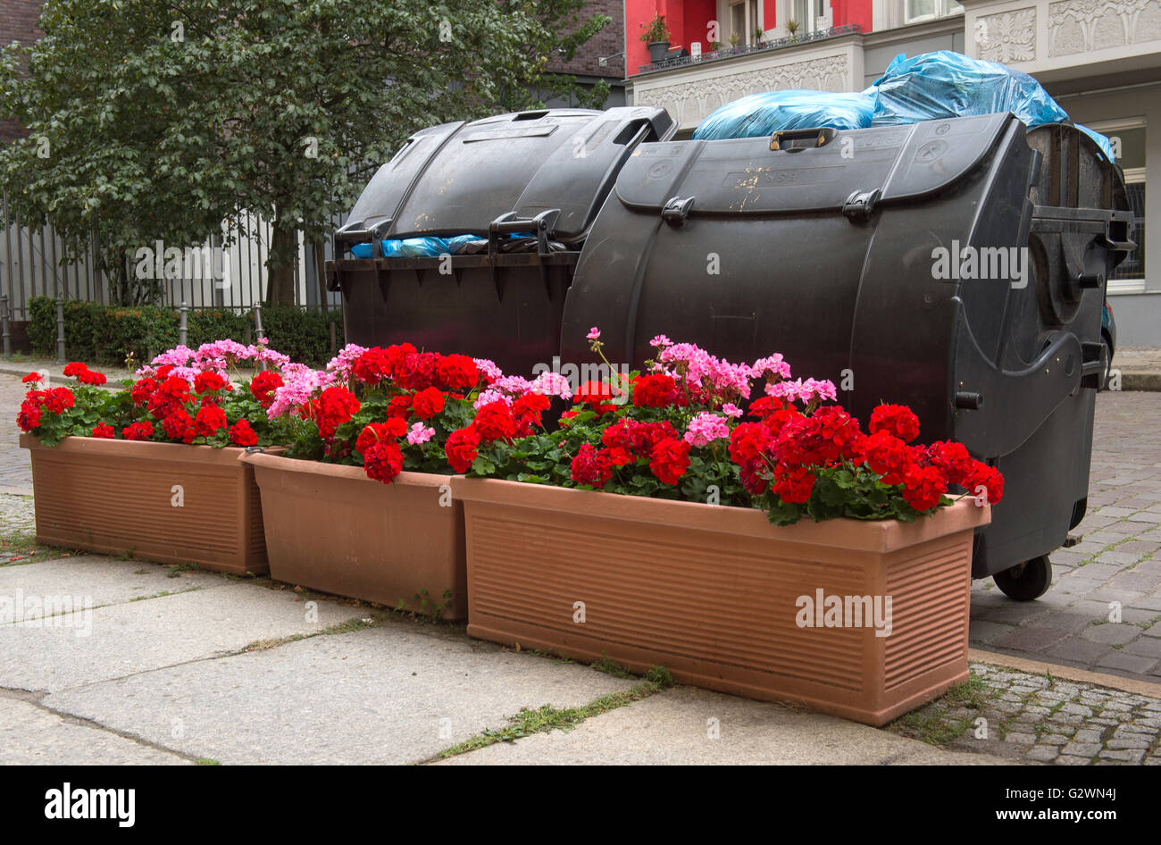 Berlin, Germany, Flower boxes are facing trash cans Stock Photo - Alamy