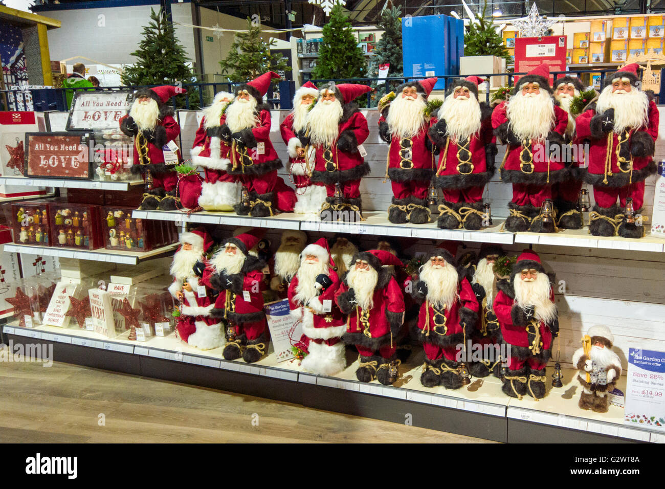 Decorative Santa Clauses on display at a garden centre Stock Photo - Alamy