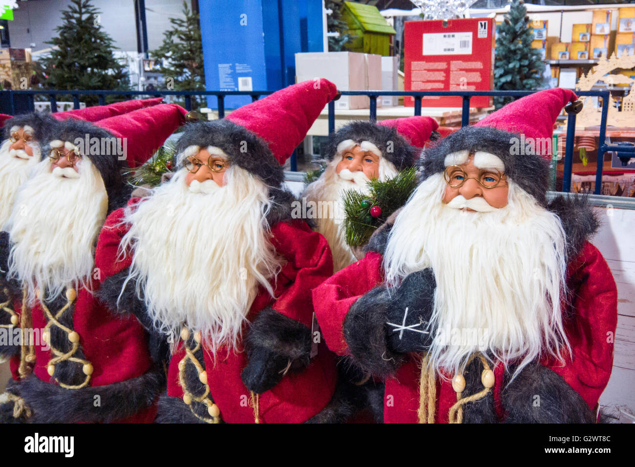 Decorative Santa Clauses on display at a garden centre Stock Photo - Alamy
