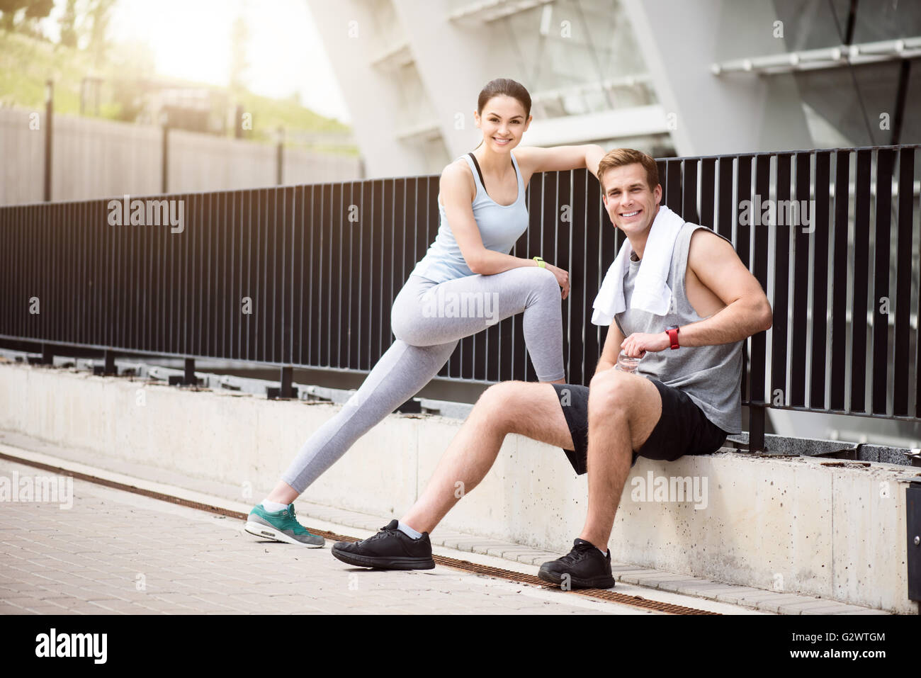 Woman and man looking at camera Stock Photo - Alamy