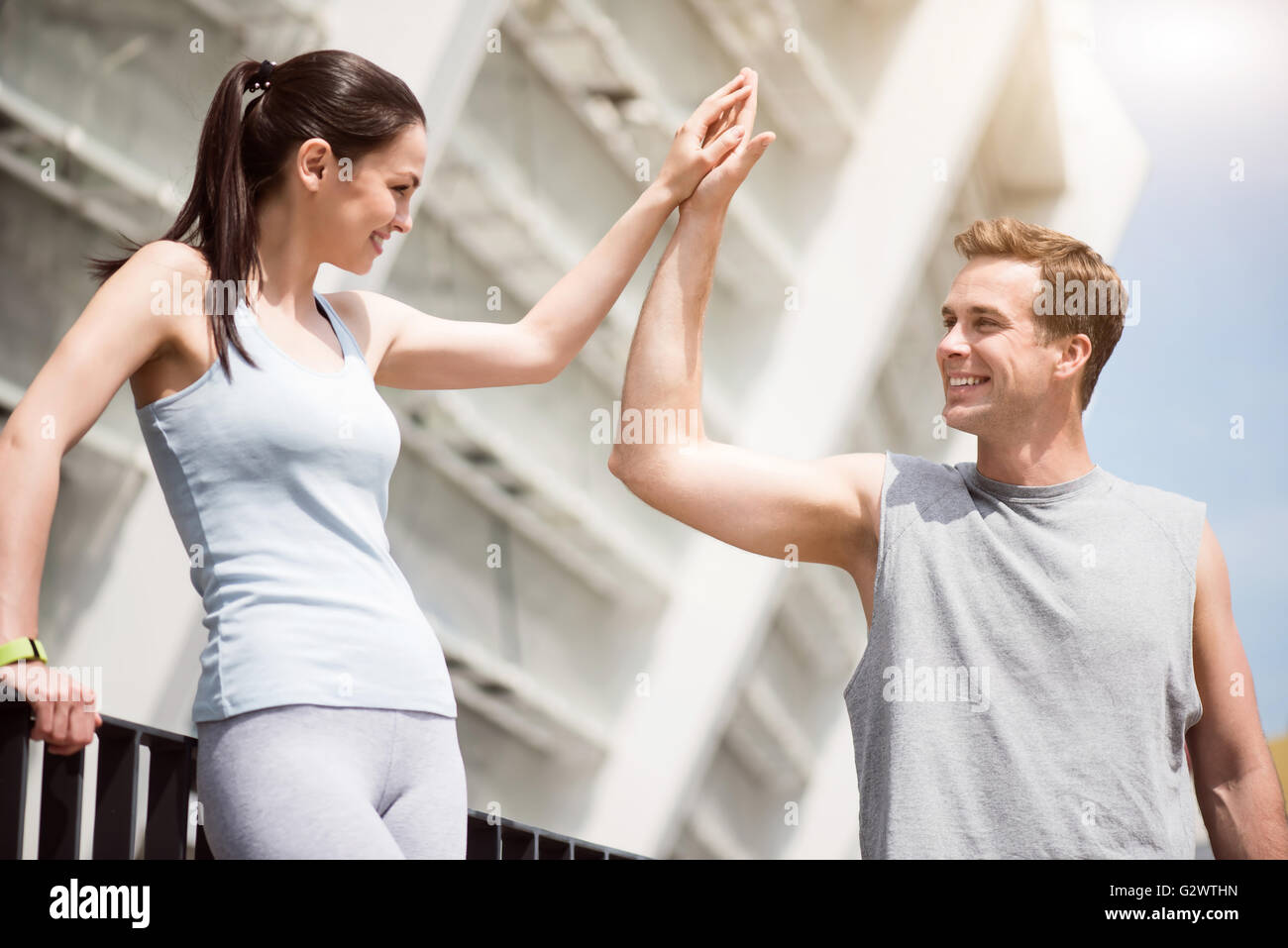 Man making gesture of high five Stock Photo - Alamy
