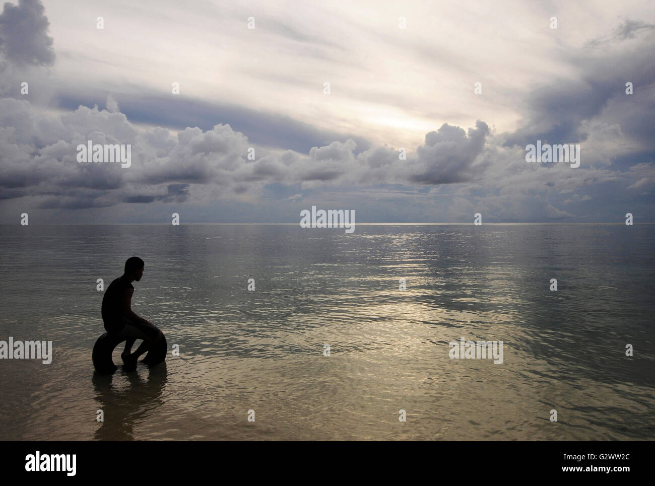Man looks out to sea from Saipan in the Northern Mariana Islands Stock ...