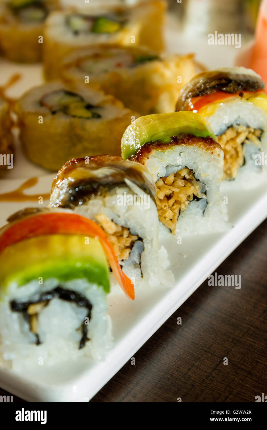 colorful sushi roll with avocado, fried noodles and crab meat Stock ...