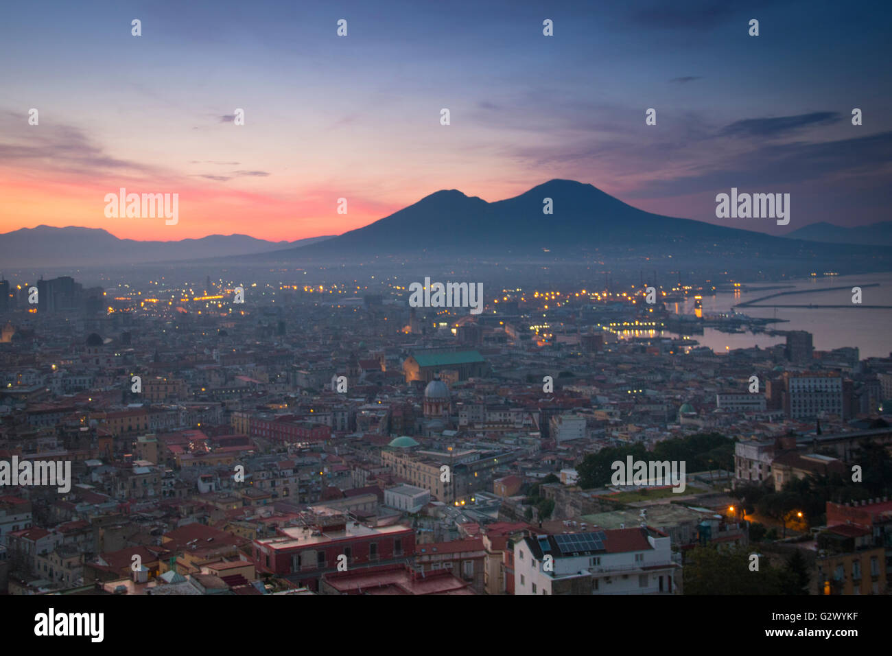 Sunrise over the city of Naples in Italy with the Visuvius volcano in ...