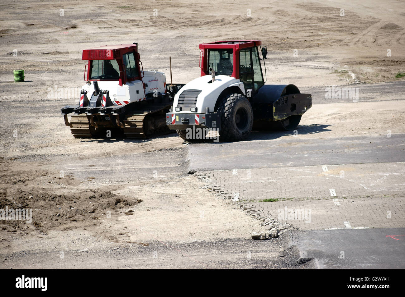 Bulldozer and roller Stock Photo - Alamy