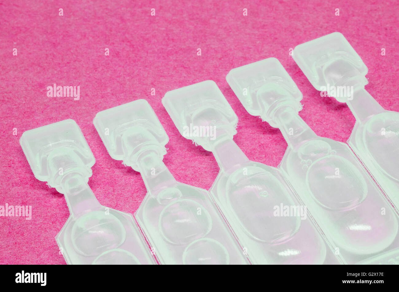 Artificial tear single use containers eye drop on paper texture ...