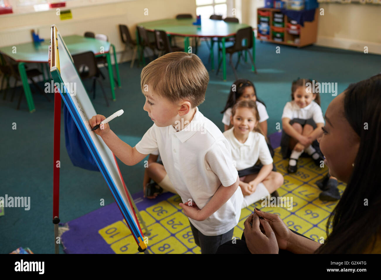 Child Writing On Whiteboard
