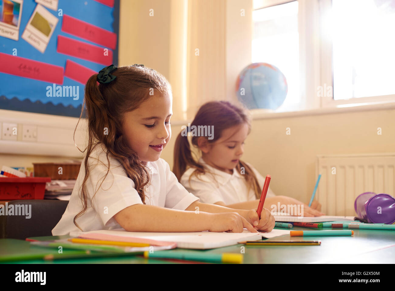 Pupils classroom uniform hi-res stock photography and images - Alamy