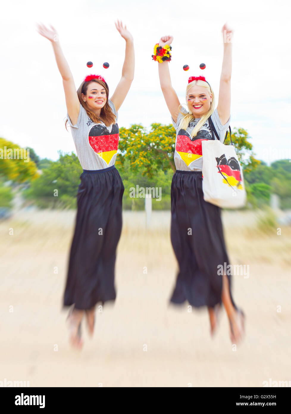 German soccer fans jumping high in the air Stock Photo - Alamy