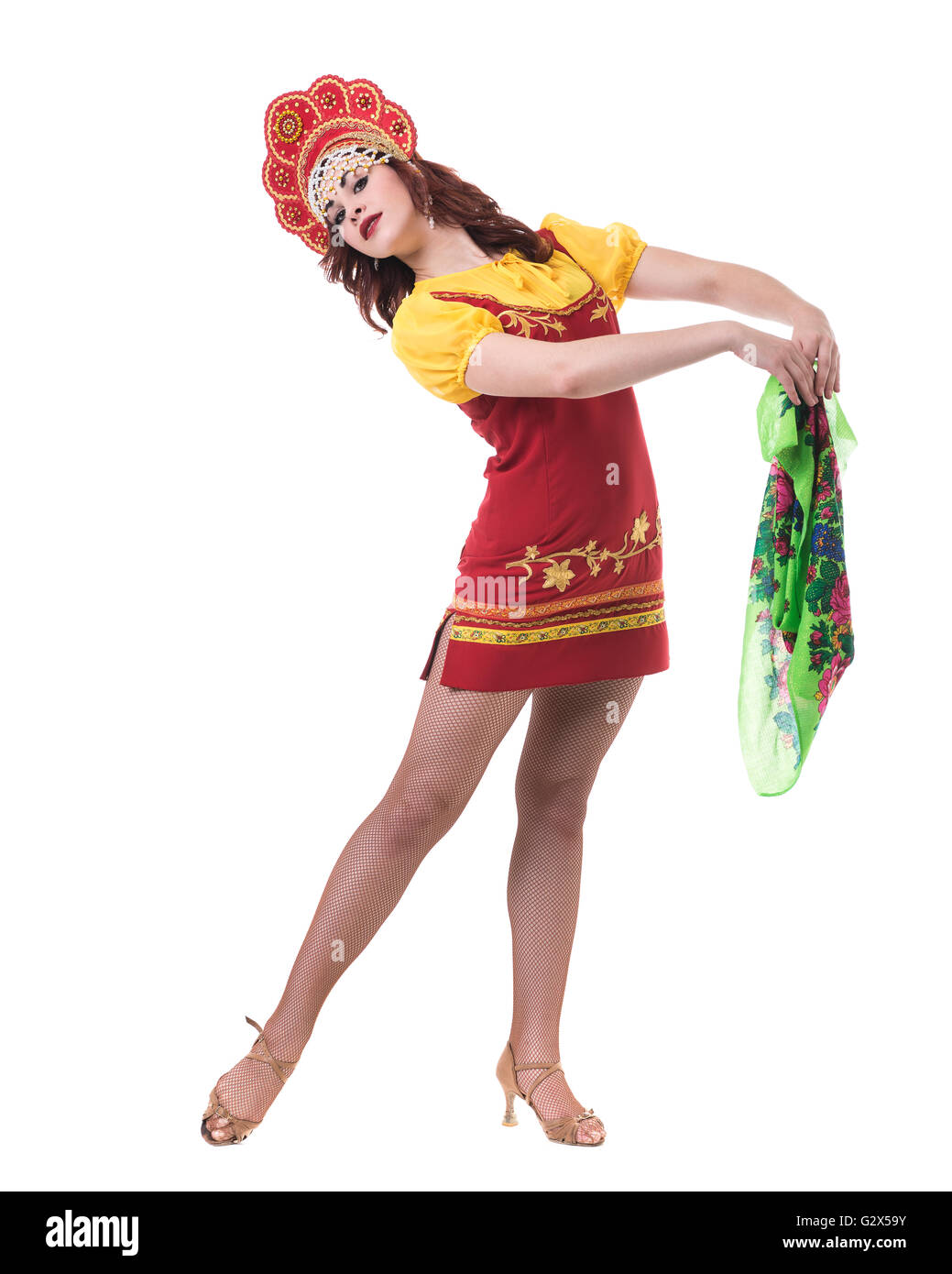 Young woman wearing a folk costumes dancing. Isolated on white in full ...