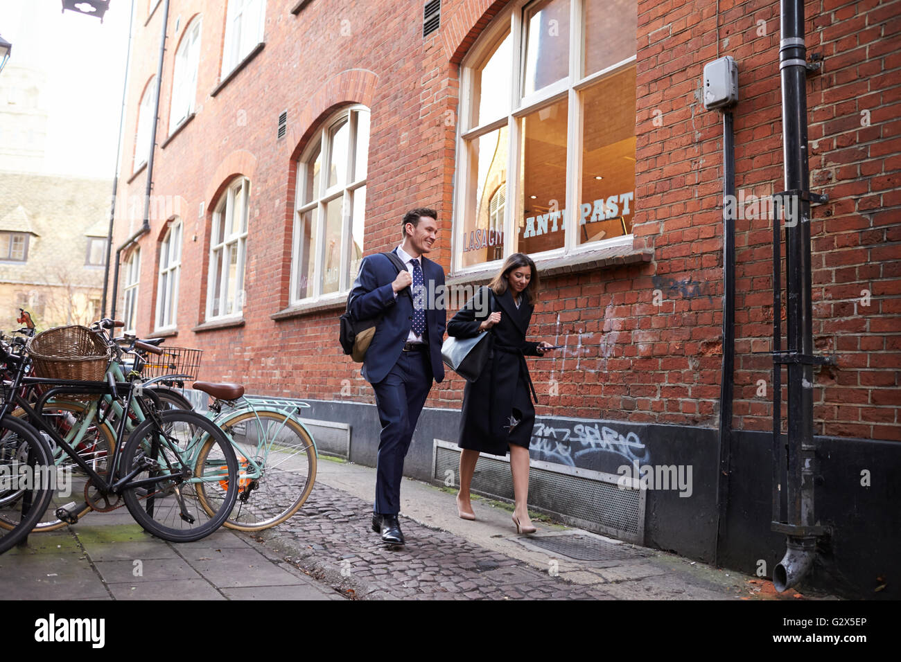 Two men walking together hi-res stock photography and images - Alamy