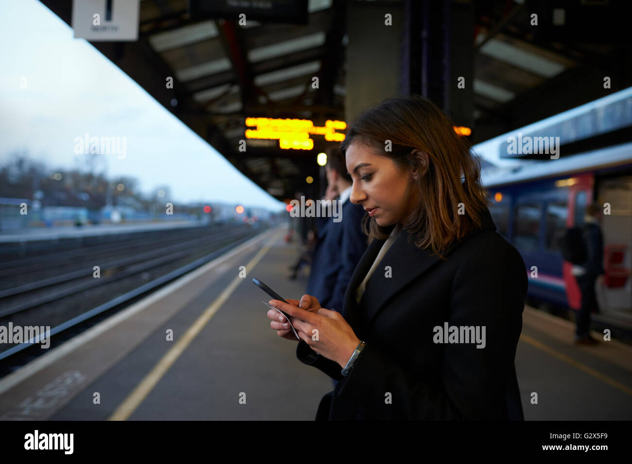 Woman on train platform hi-res stock photography and images - Alamy