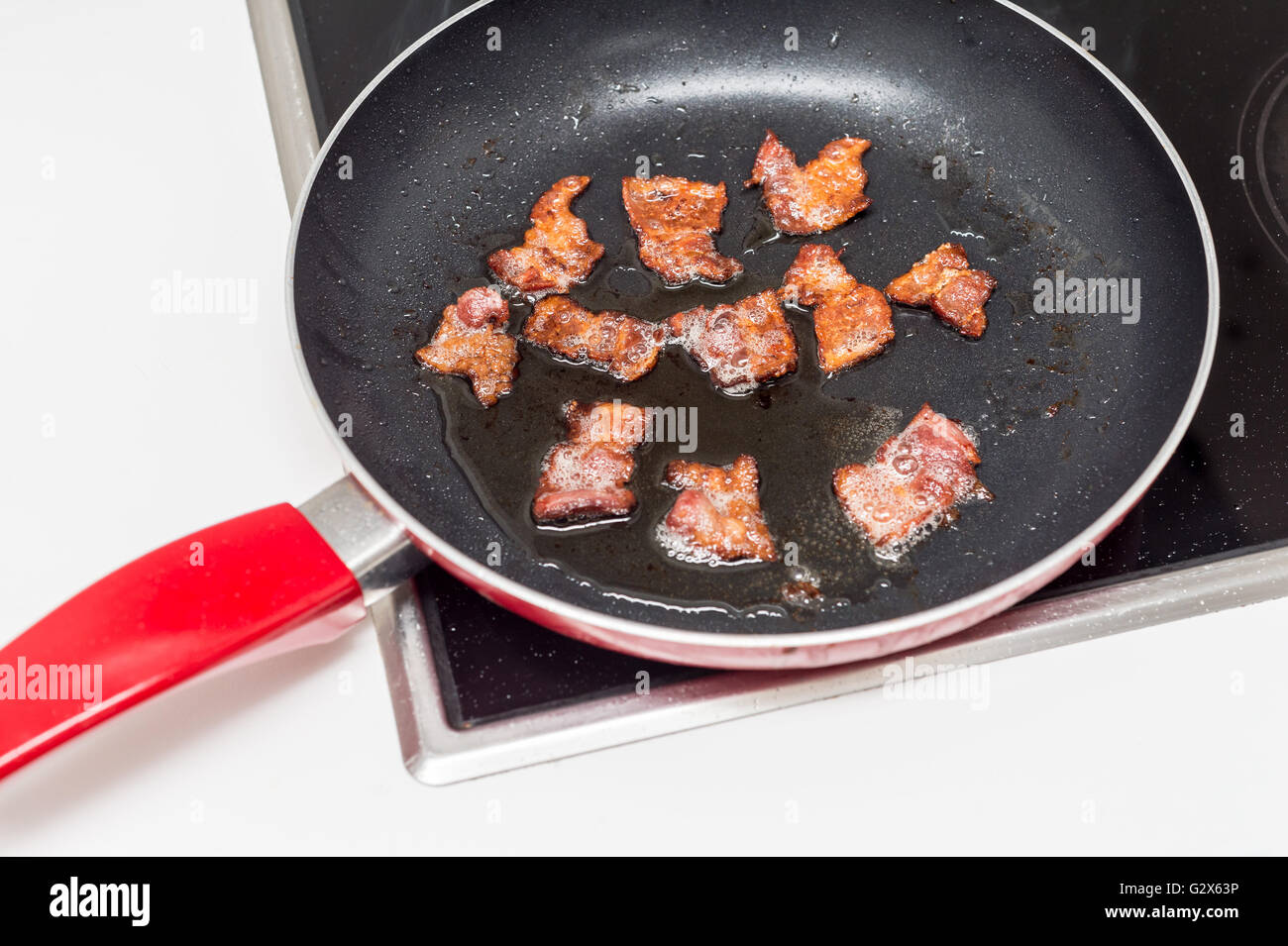 Fried Bacon Pieces in a Pan Stock Photo - Alamy