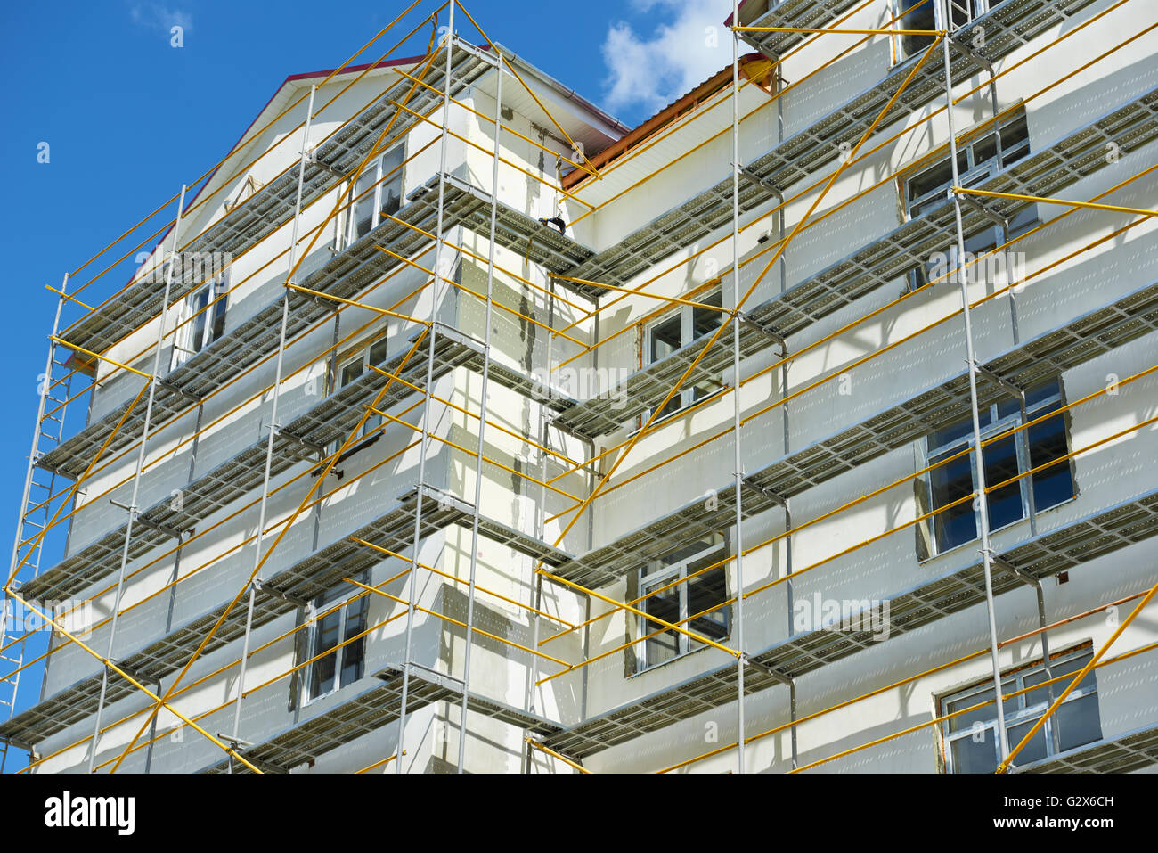 scaffolding near a house under construction for external plaster works ...