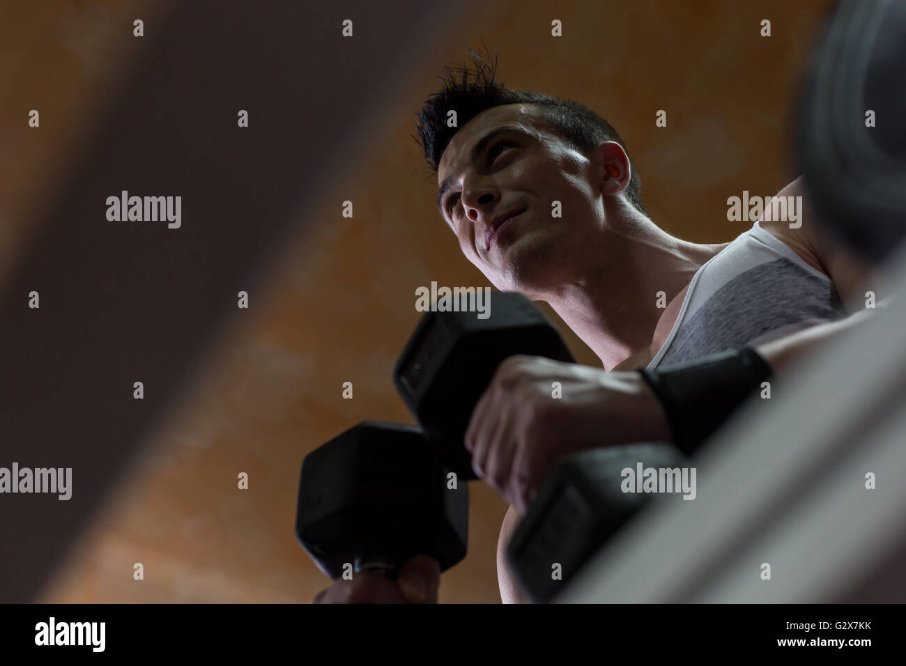 Strong man at the gym lifting heavy weights Stock Photo - Alamy