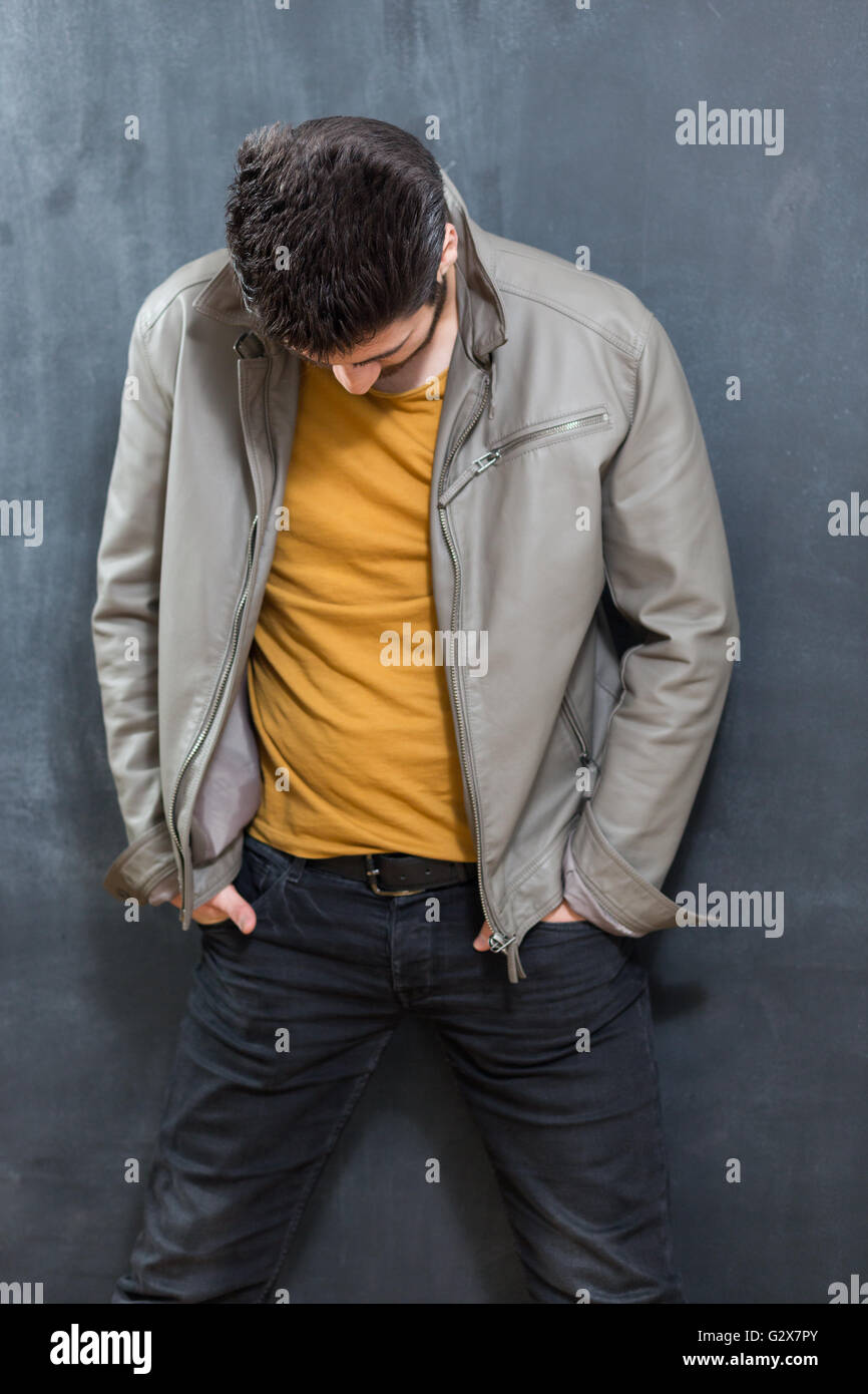 Portrait of masculinity. Portrait of handsome young bearded manstanding ...