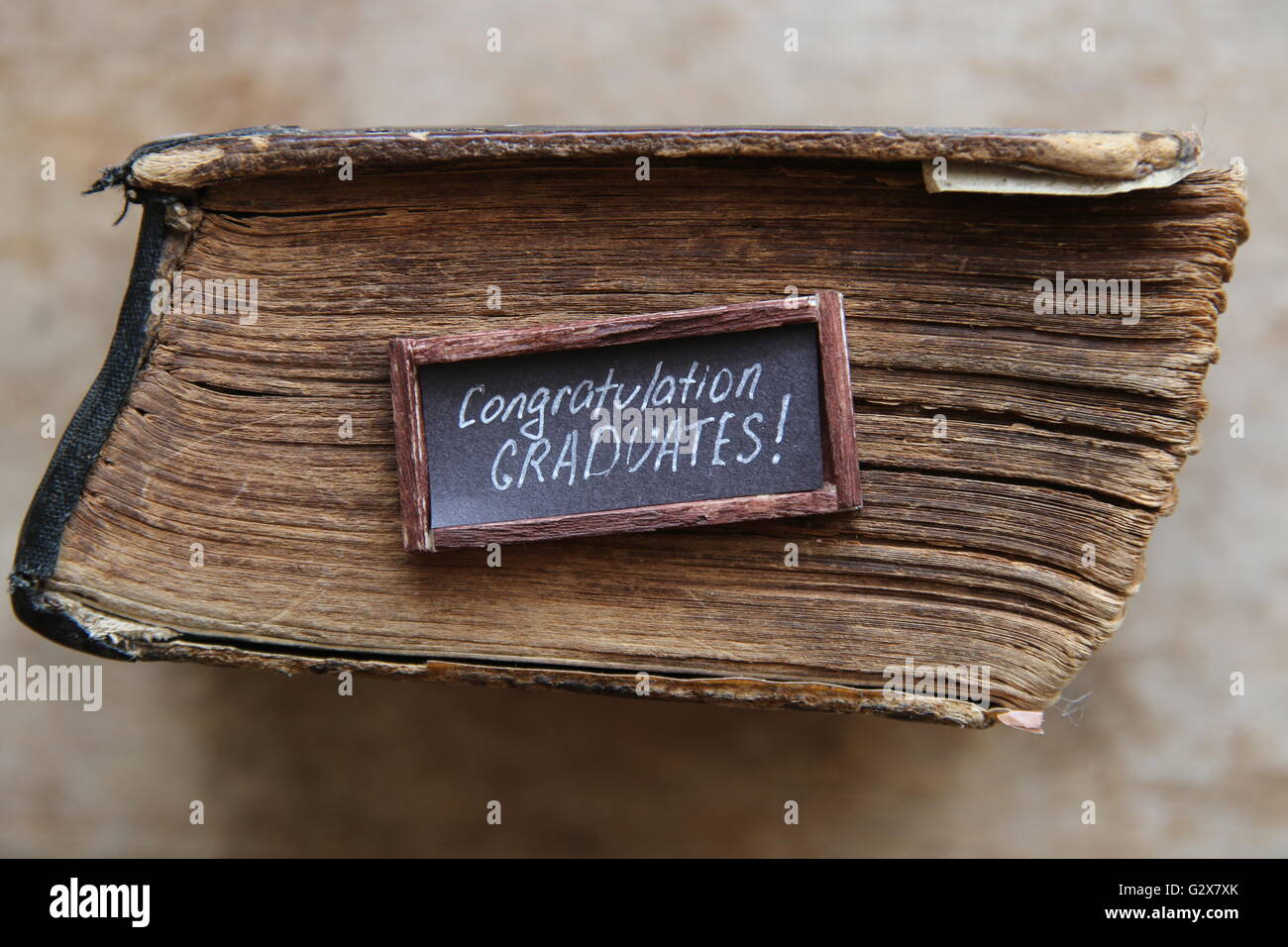 congratulations graduates text and vintage book on table Stock Photo ...