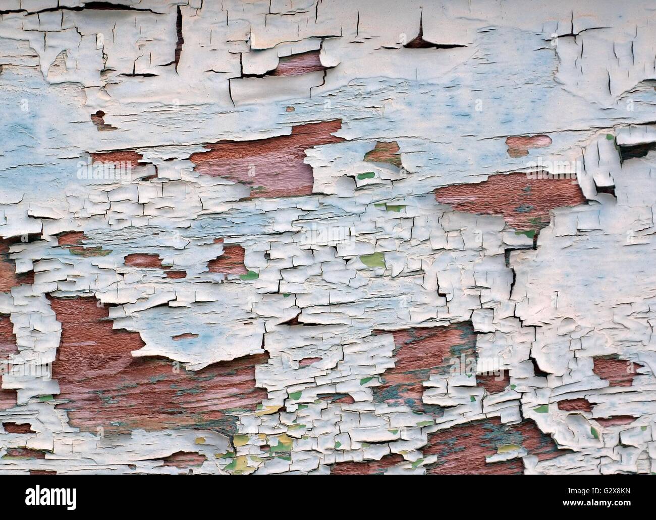 The paint is falling off from the wall of an old wooden house Stock ...