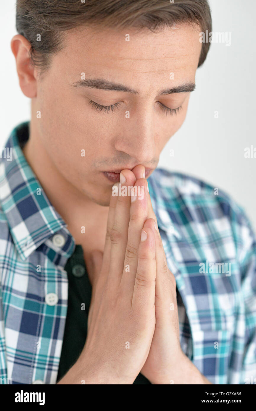 Thoughtful young man Stock Photo - Alamy