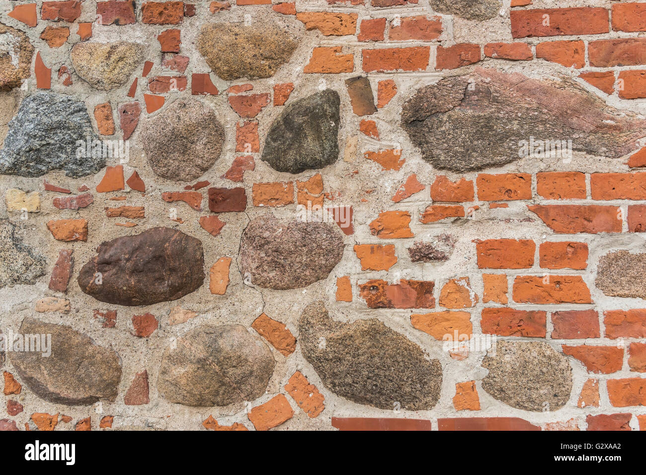 Details of a wall made of bricks and rubble stones Stock Photo - Alamy