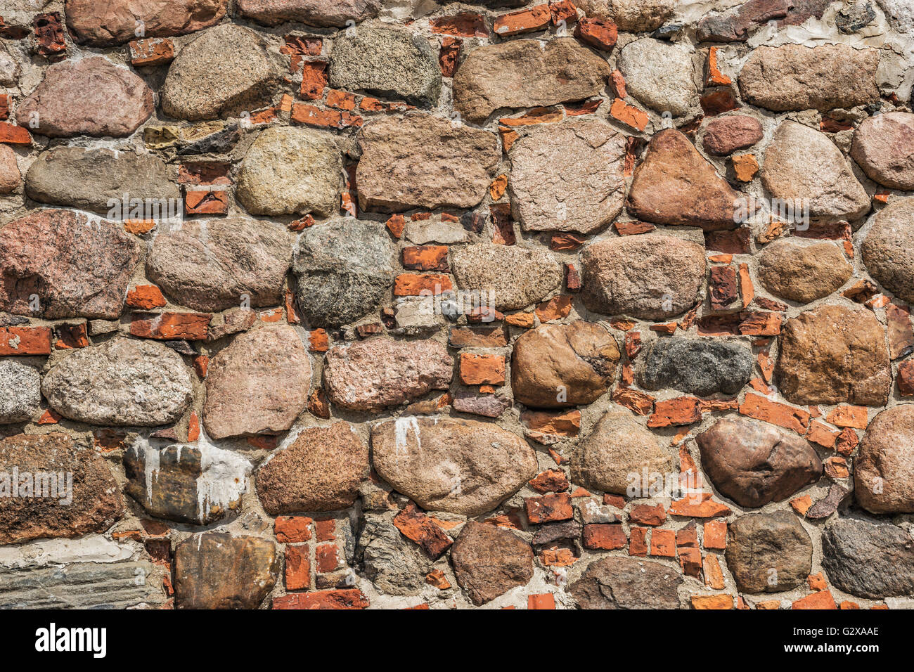 Details of a wall of small rubble stones Stock Photo - Alamy