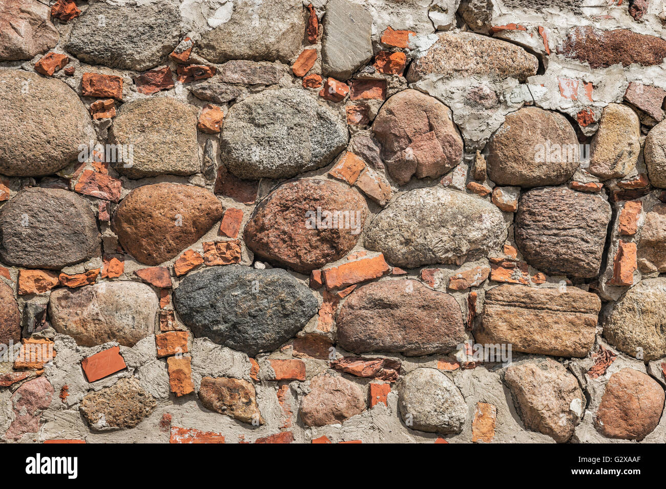 Details of a wall of small rubble stones Stock Photo - Alamy