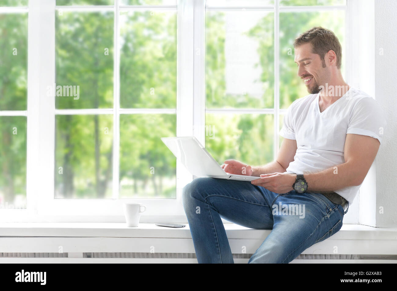 young man with computer laptop Stock Photo - Alamy