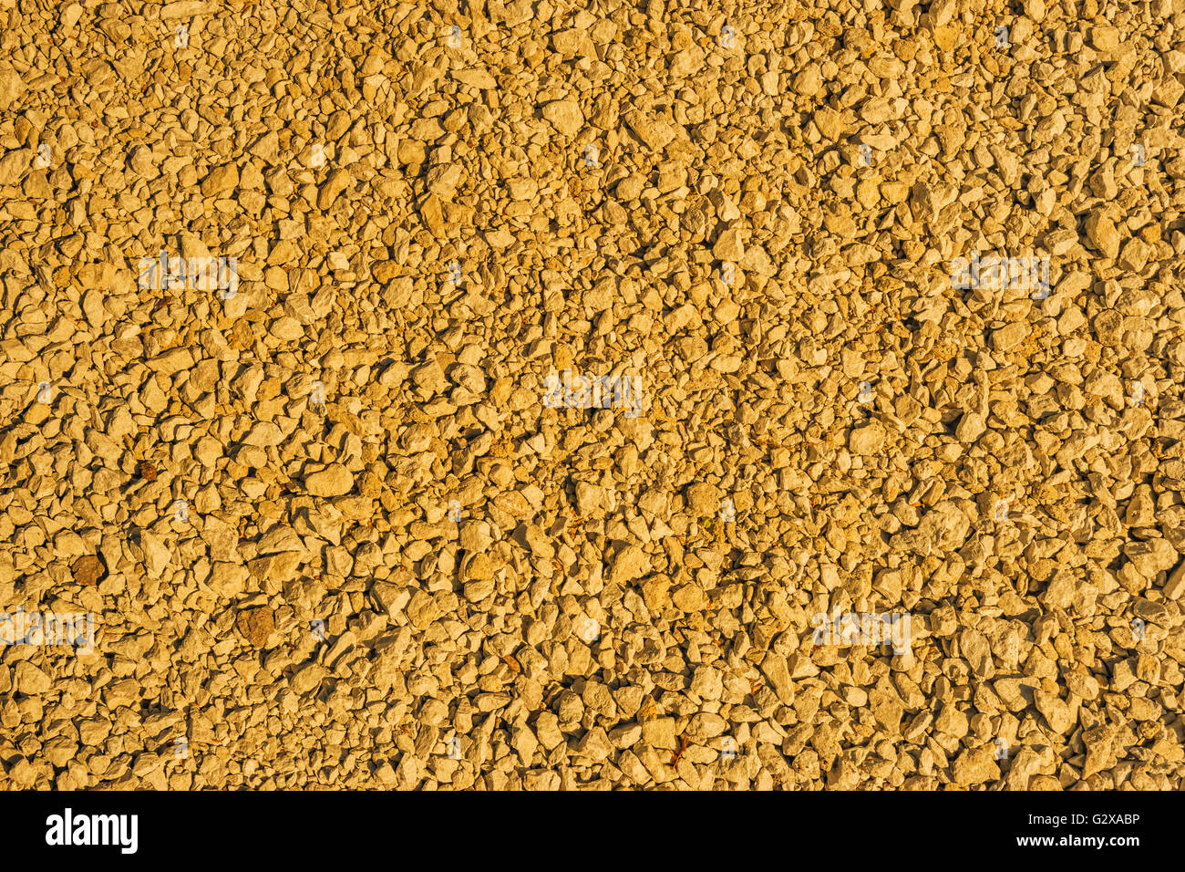 crushed stones, many small stones, yellow color Stock Photo - Alamy