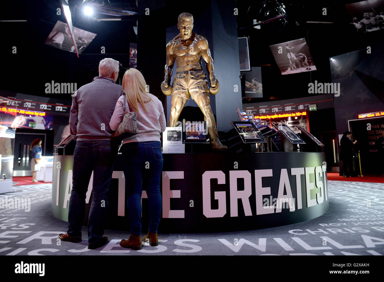 Visitors look at a statue of Muhammad Ali on display at the Muhammad ...