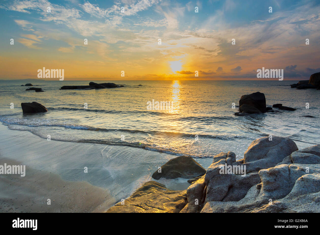 Beach rock and wave with sunrise skies background Stock Photo - Alamy