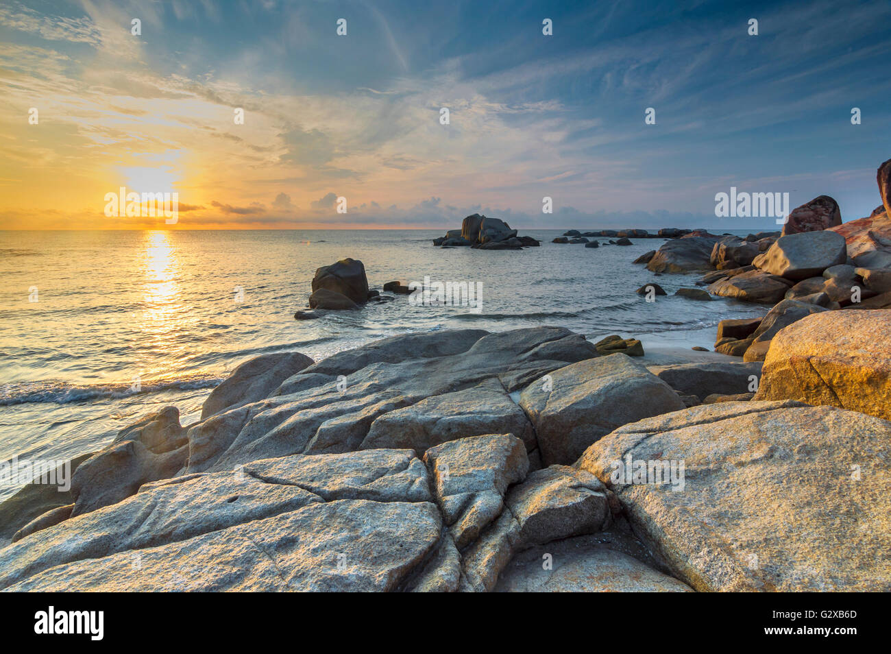 Beach rock and wave with sunrise skies background Stock Photo - Alamy