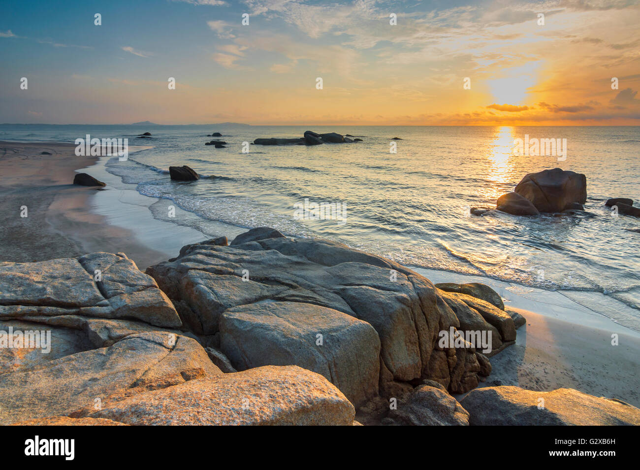 Beach rock and wave with sunrise skies background Stock Photo - Alamy