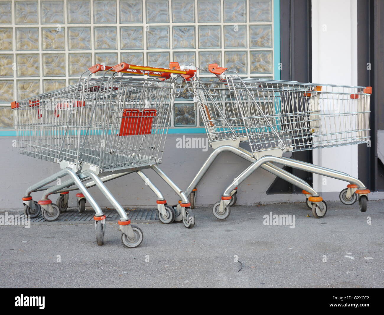 Cart, parked messy on a wall Stock Photo - Alamy