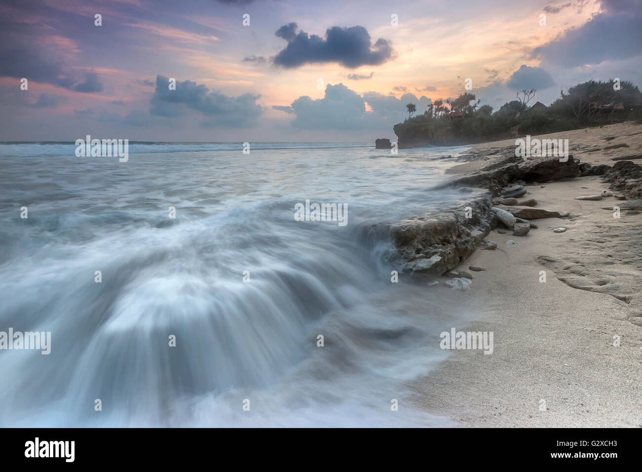 Wave splash on natural coastal rock during amazing sunset Stock Photo ...