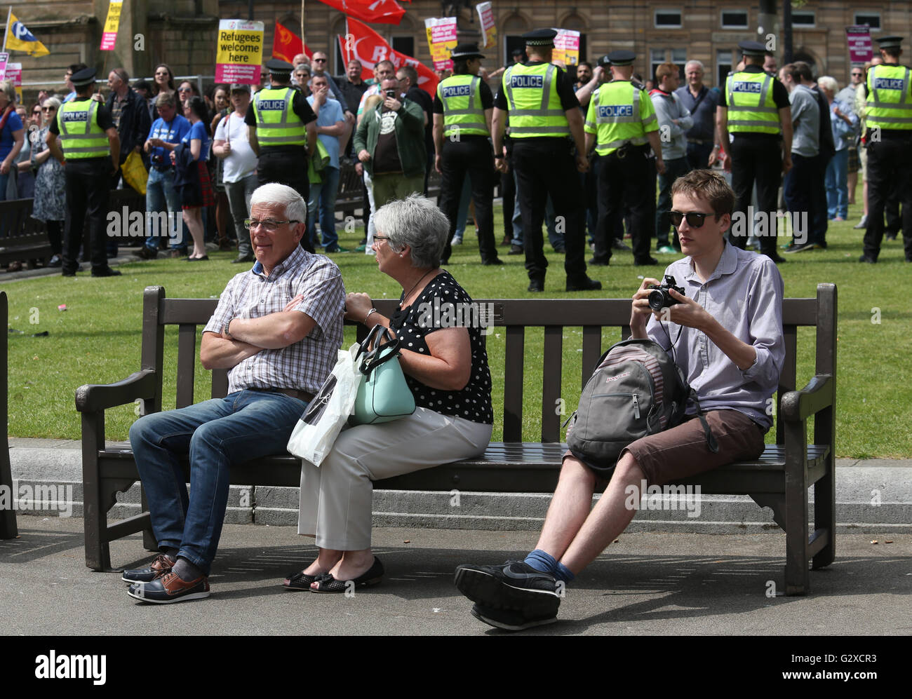 People sit on a bench during a demonstration by the Scottish Defence ...