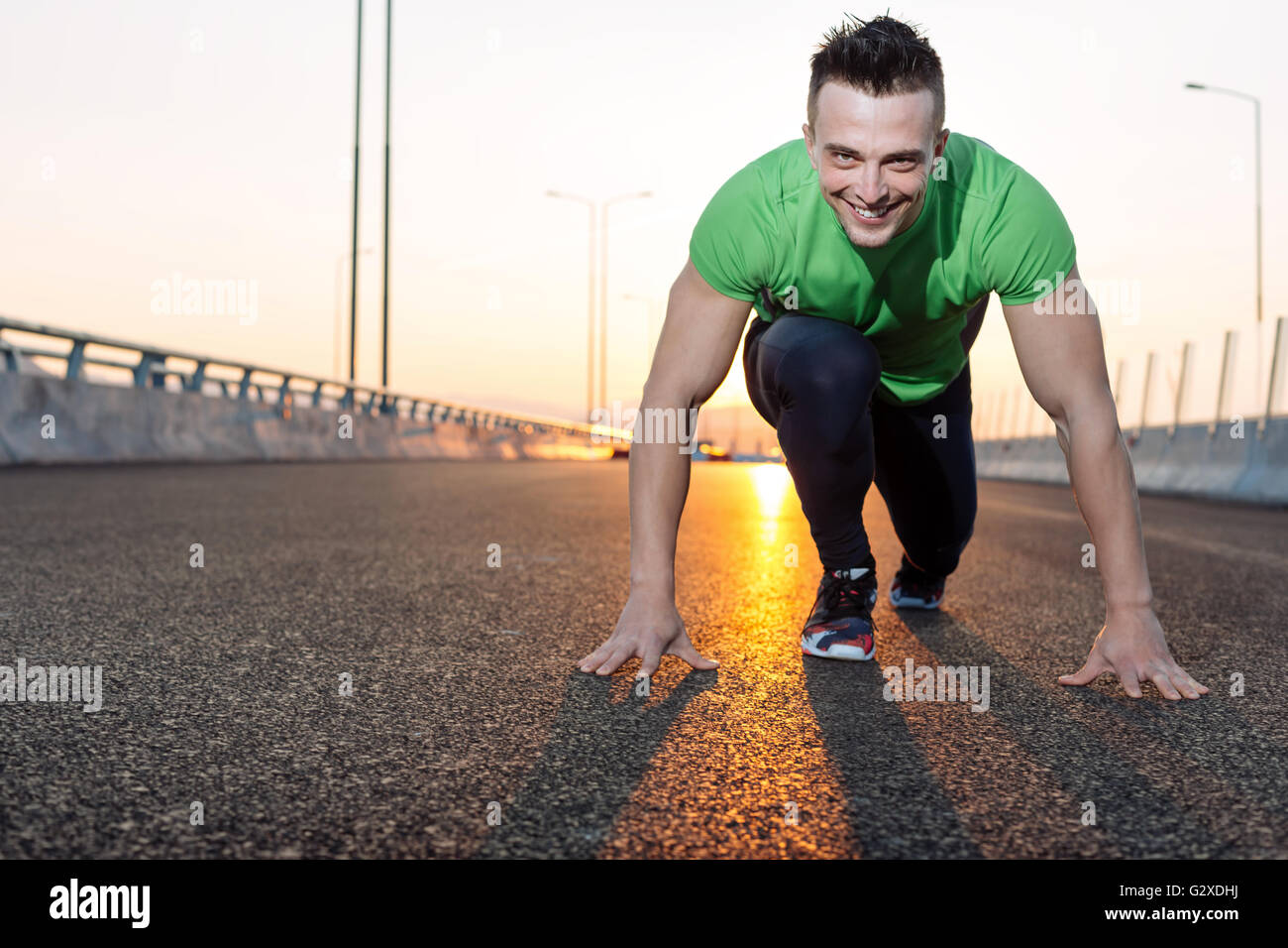 Runner crouching starting block hi-res stock photography and images - Alamy