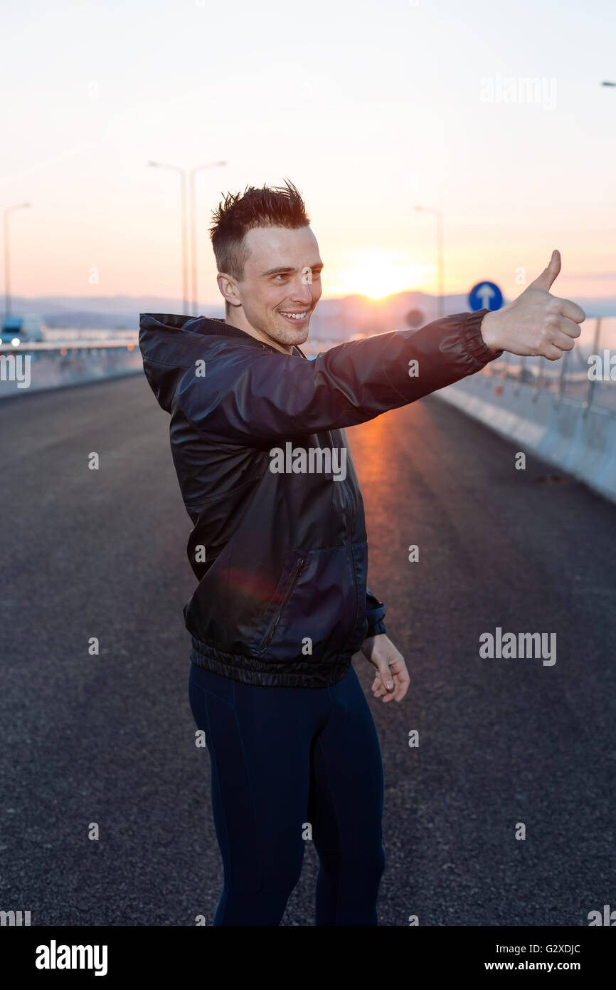 Half Body Shot of a Smiling Fit Guy at the hifgway sunset, Showing ...