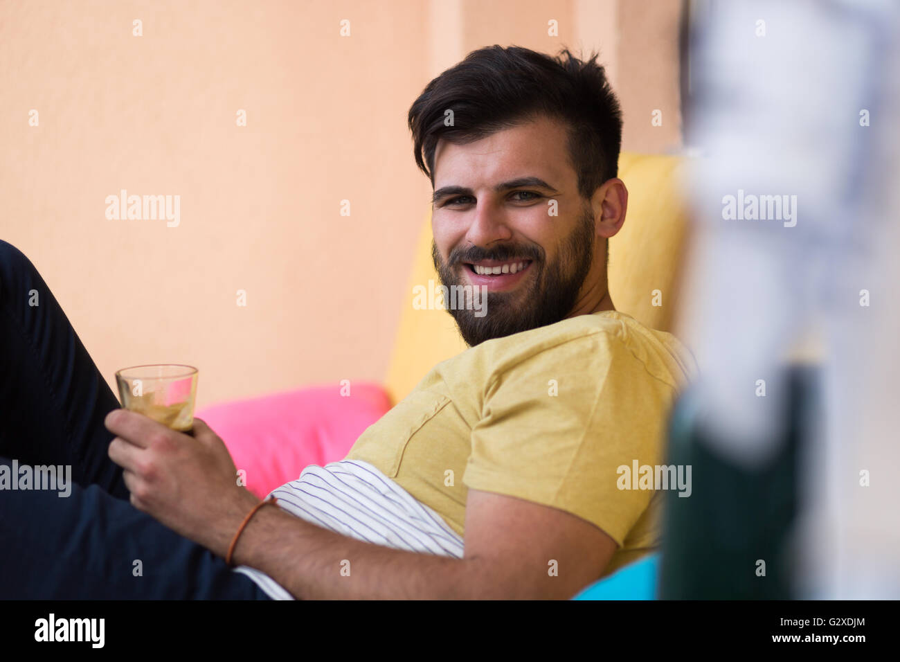 Inspired with cup of fresh coffee. Handsome young man drinking coffee ...