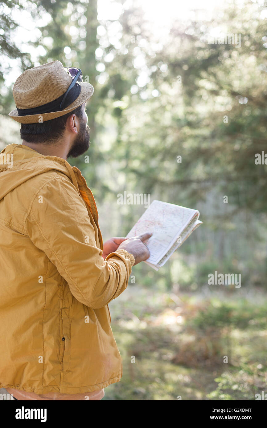 Hiker in nature. man in nature using map Stock Photo - Alamy