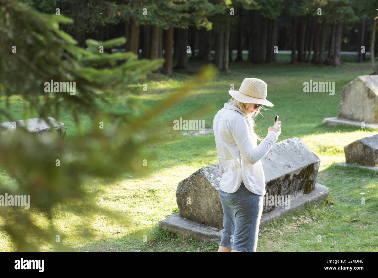 A young woman is exploring the medieval tomb, woman archaeologist Stock ...