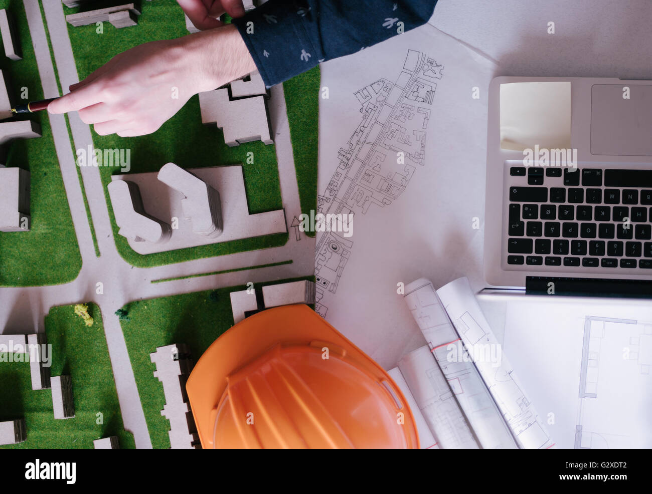 Architect working on blueprint. Architects workplace - architectural ...