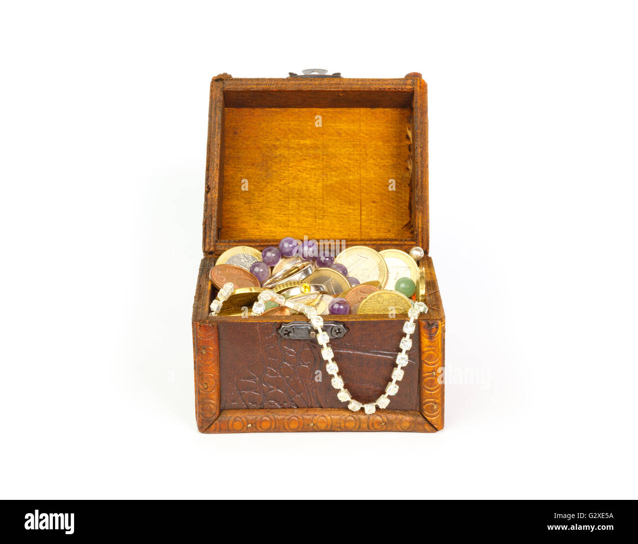 Open treasure chest with jewelry and money against white background ...