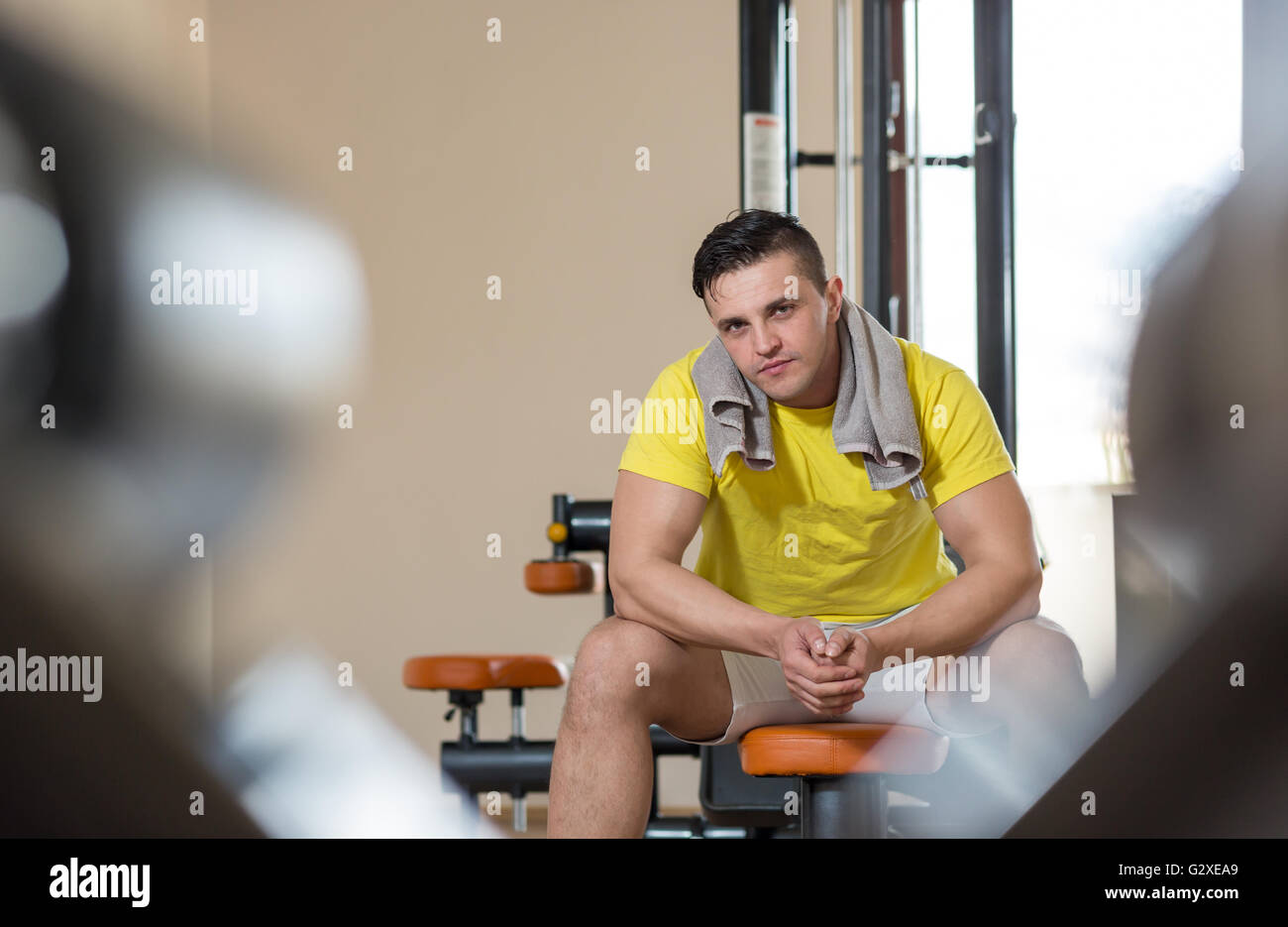 Athlete muscular brutal bodybuilder emotional posing in the gym ...