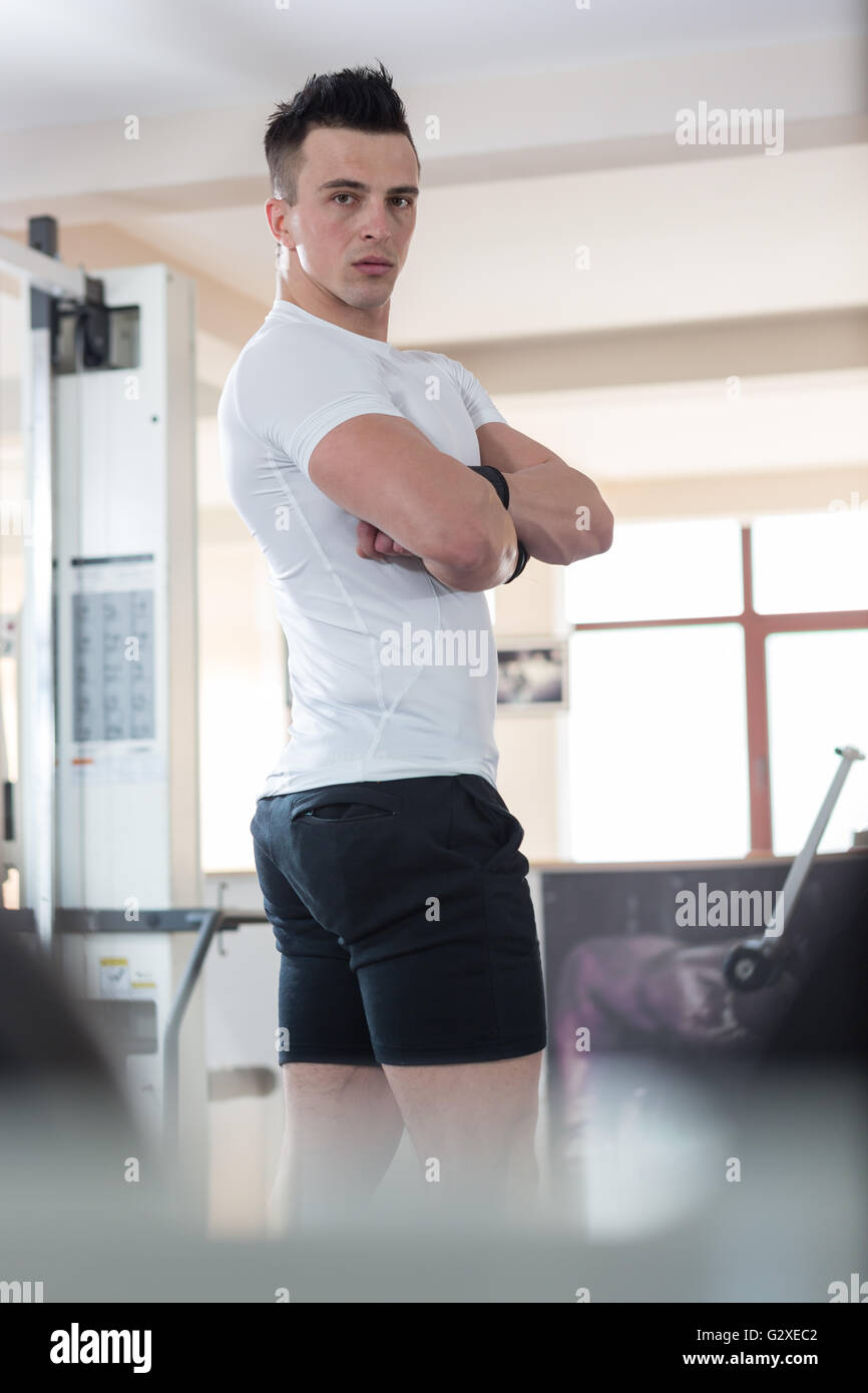 Sporty Man Resting In A Gym. Portrait Of A Young Muscular Sporty Fit ...