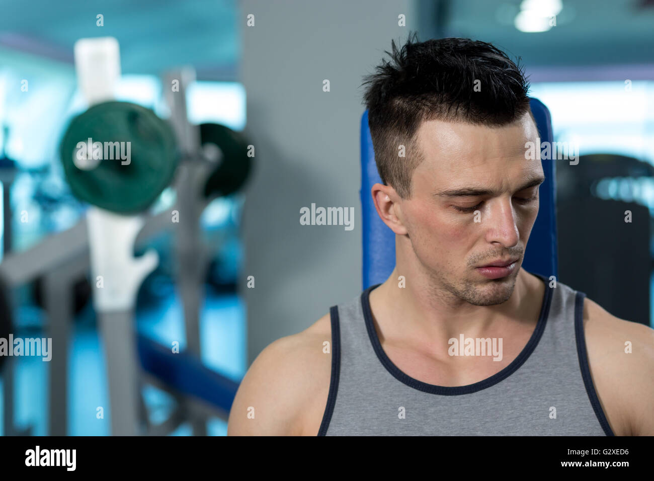 Man at the gym exercising Stock Photo - Alamy