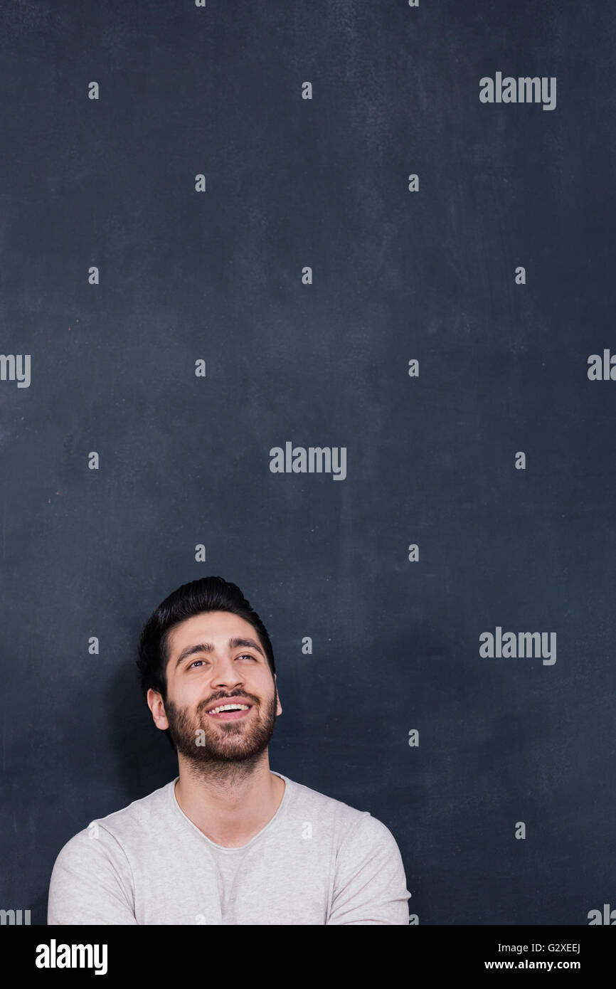 Young handsome man with great smile on the black background Stock Photo ...