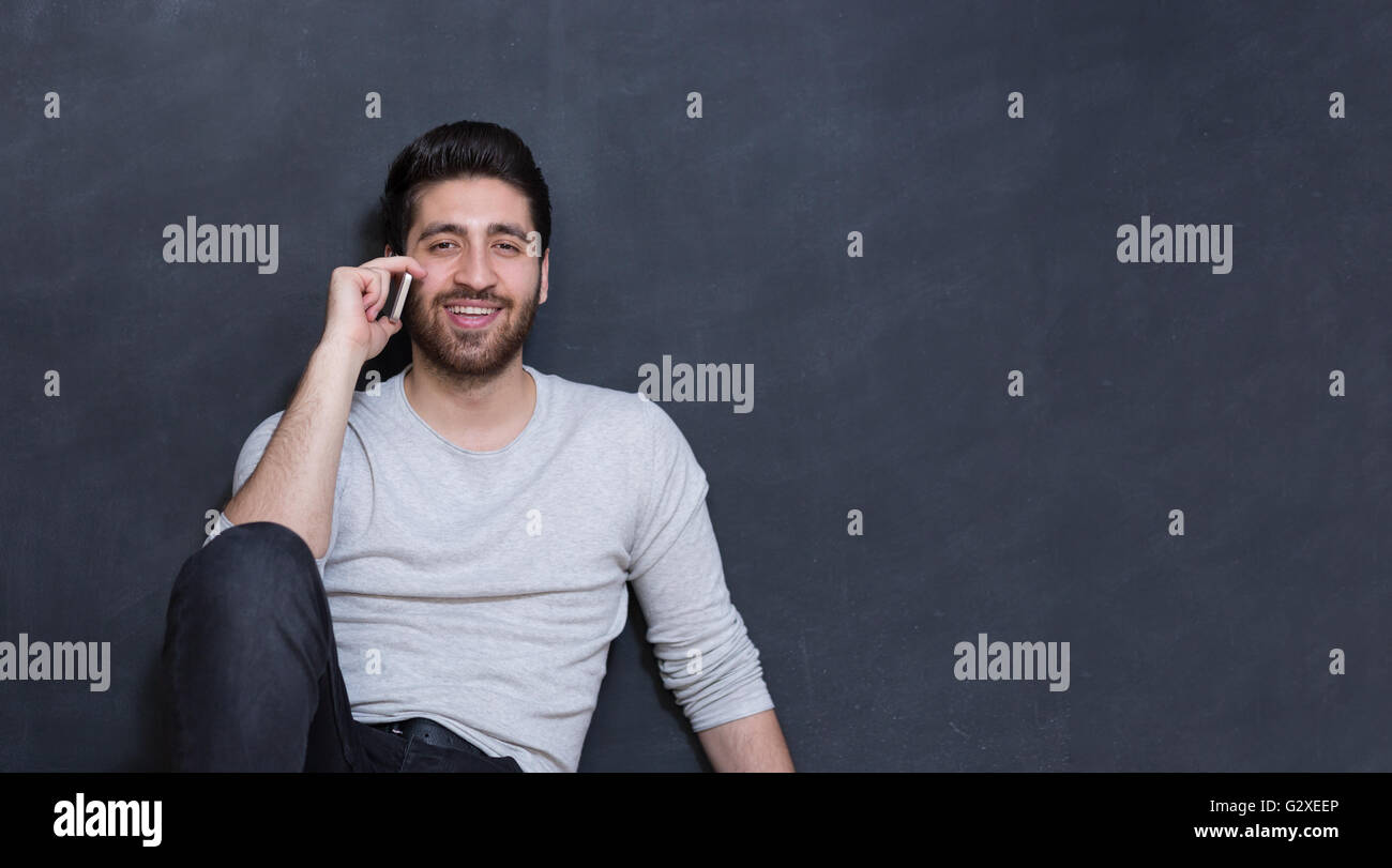 Casually handsome. Portrait of joyful young Arabic man standing against ...